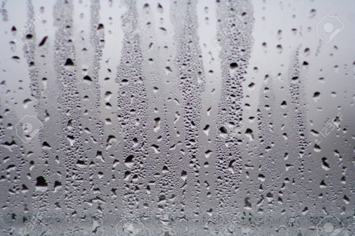 Background with water drops on the glass. Water vapor on the win ...
